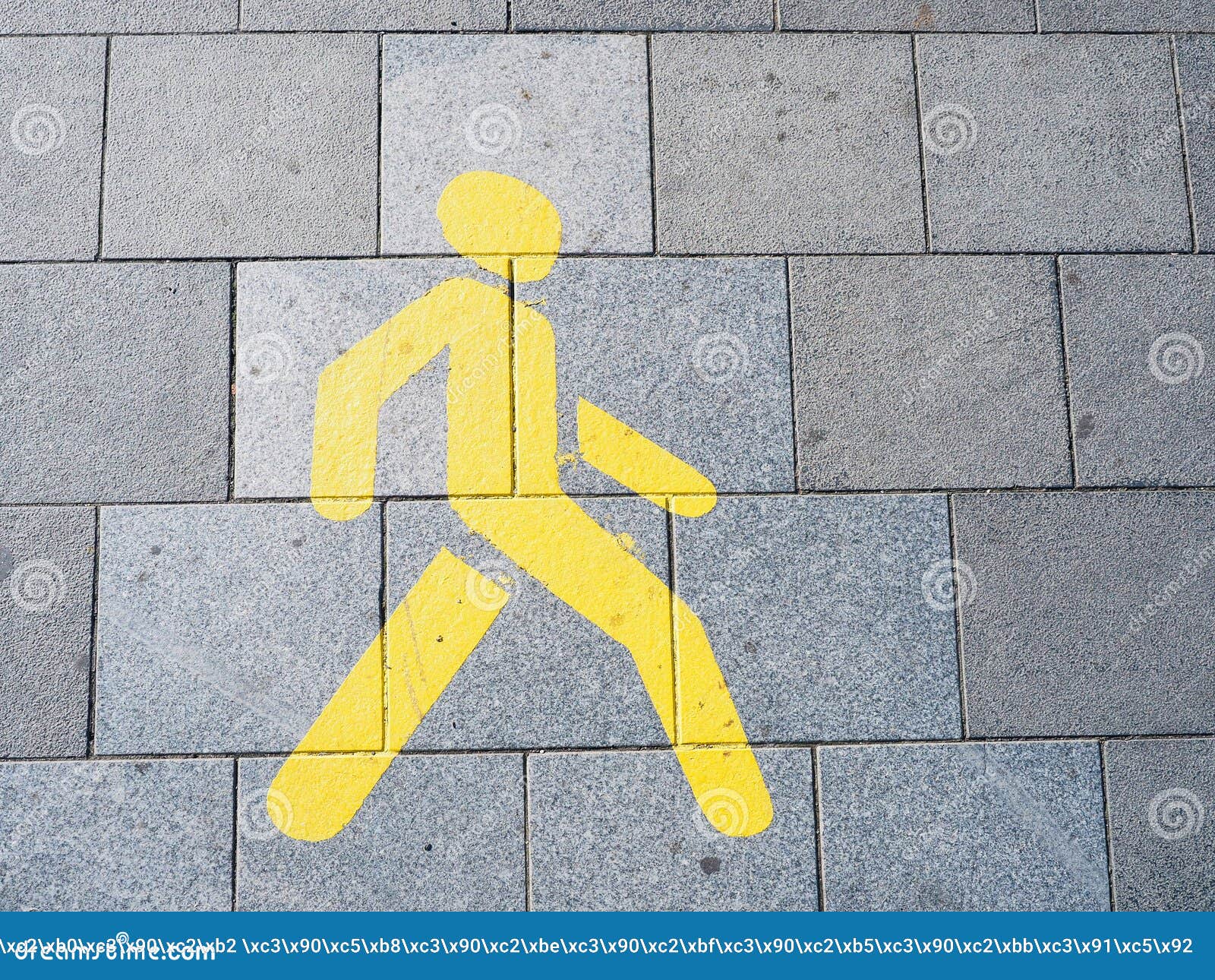 The Figure of a Yellow Man Painted with Paint on a Gray Granite Stock ...