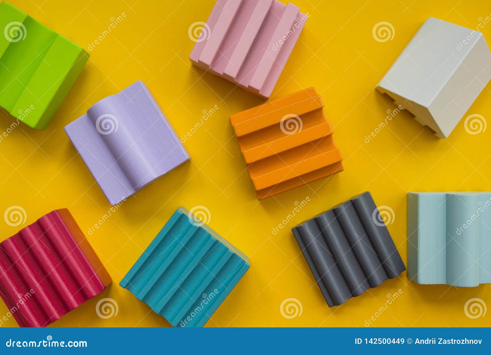 The Figures Of Different Colors On A Yellow Background Stock Image ...