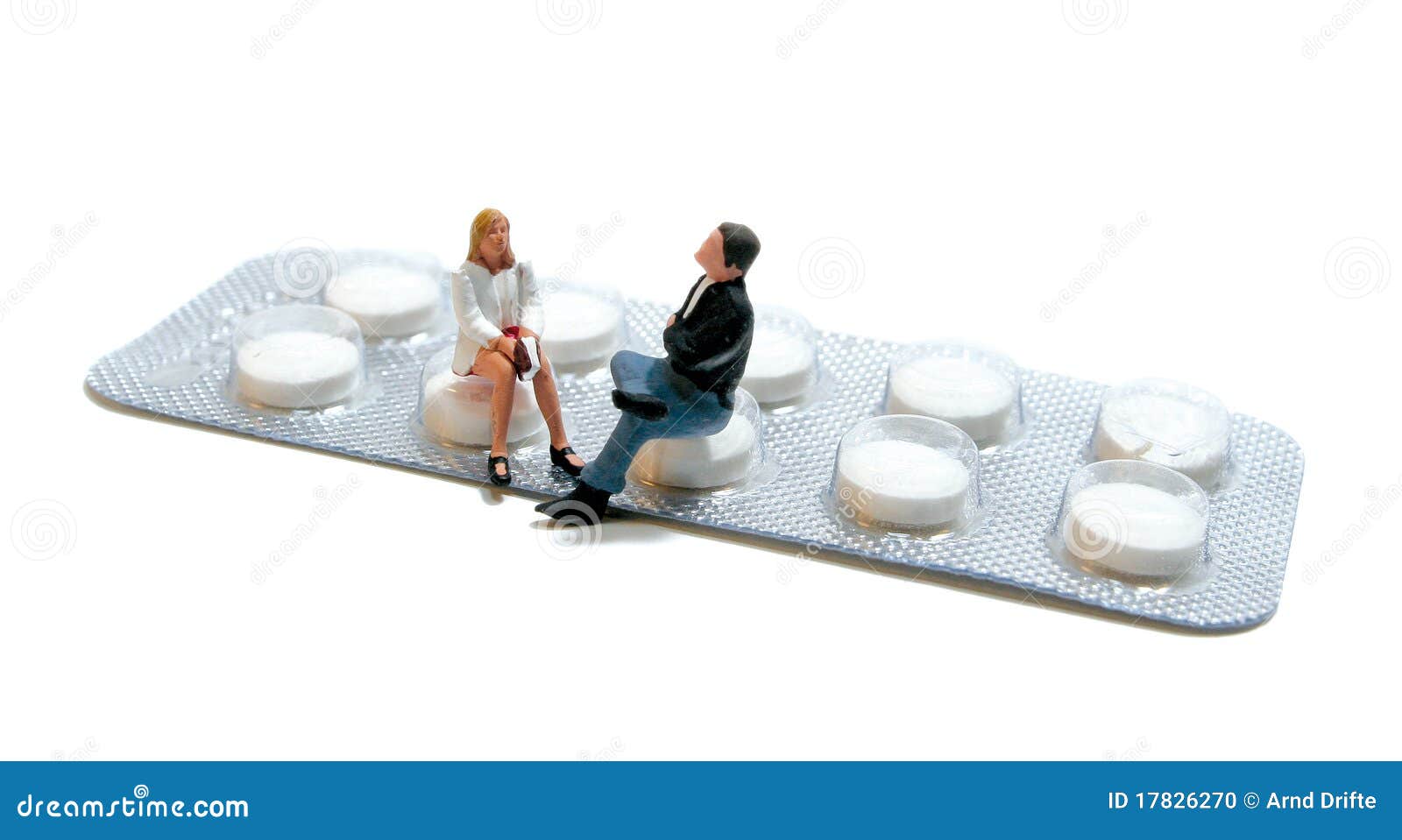 Figures sitting on pills stock photo. Image of bacteria - 17826270