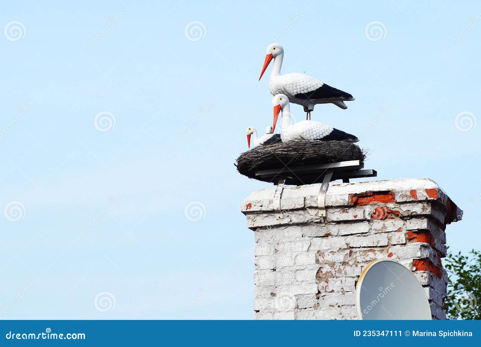 Figures of Storks on the Brick Chimney of the House Stock Image - Image ...