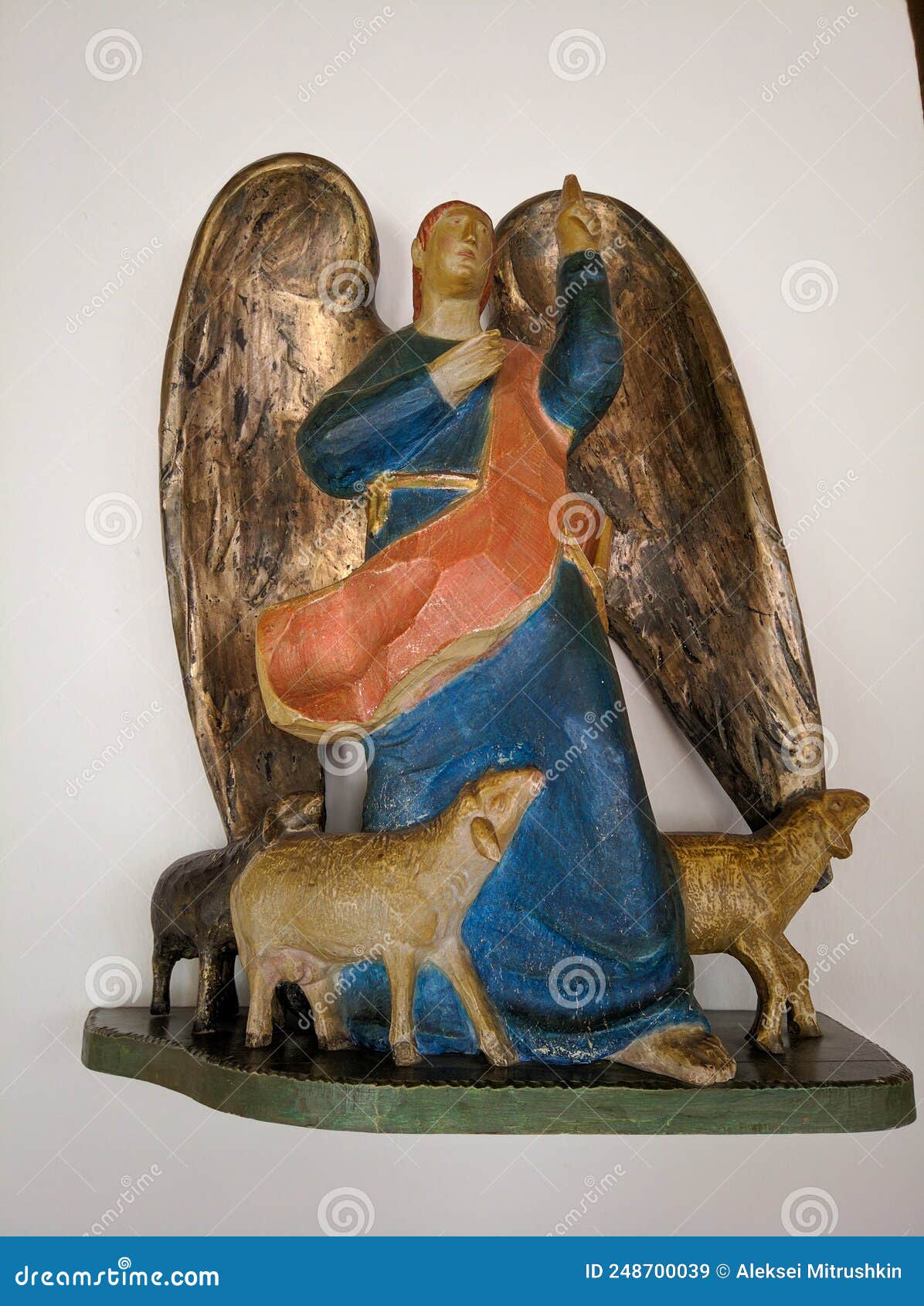 Figurine of an Angel with Wings Standing Next To the Sheeps Hangs on ...