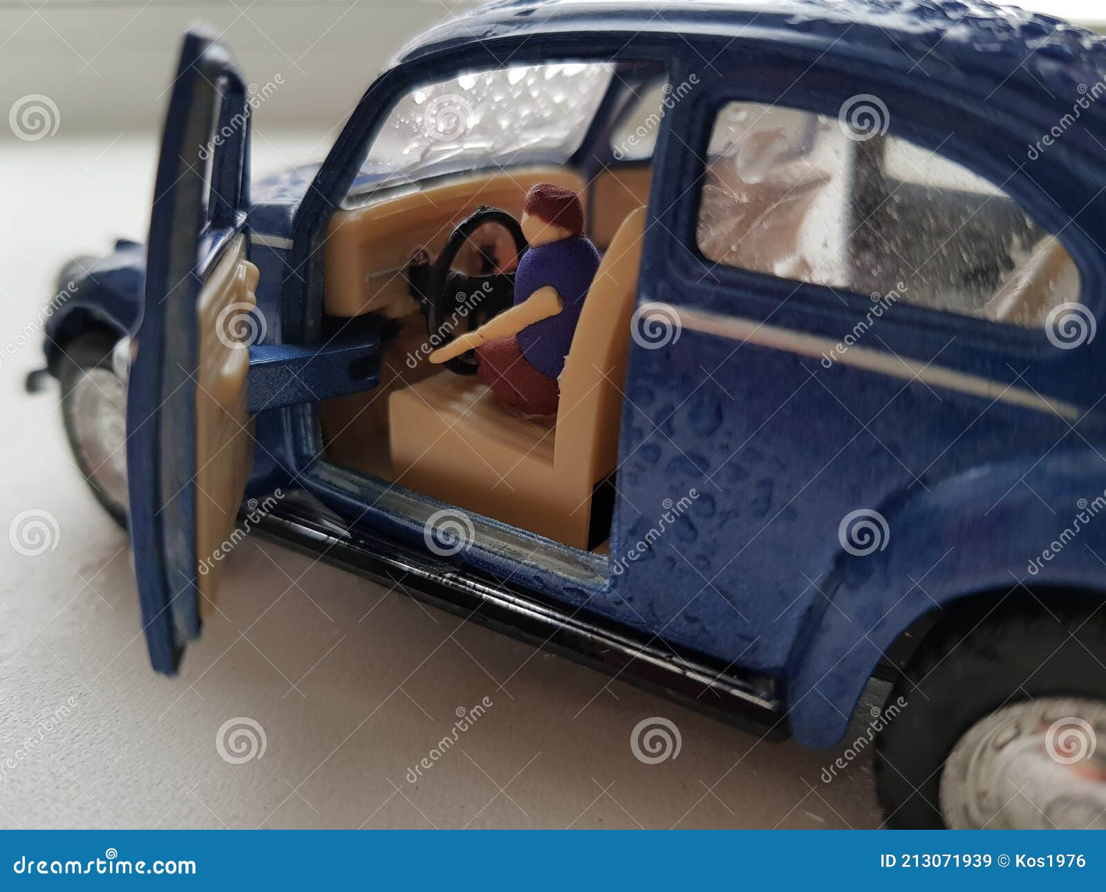 Figurine of a Driver in a Toy Car Stock Image - Image of metal ...