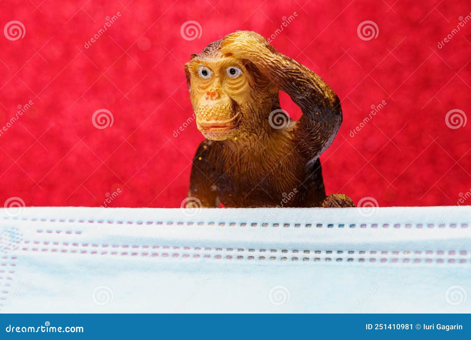 Figurine of a Monkey Behind a Medical Surgical Mask. the Concept of ...