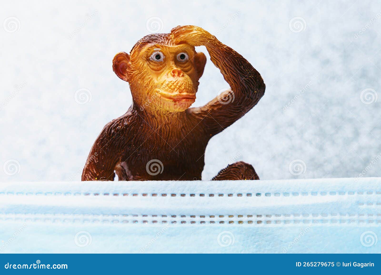 Figurine of a Monkey Behind a Medical Surgical Mask. the Concept of ...