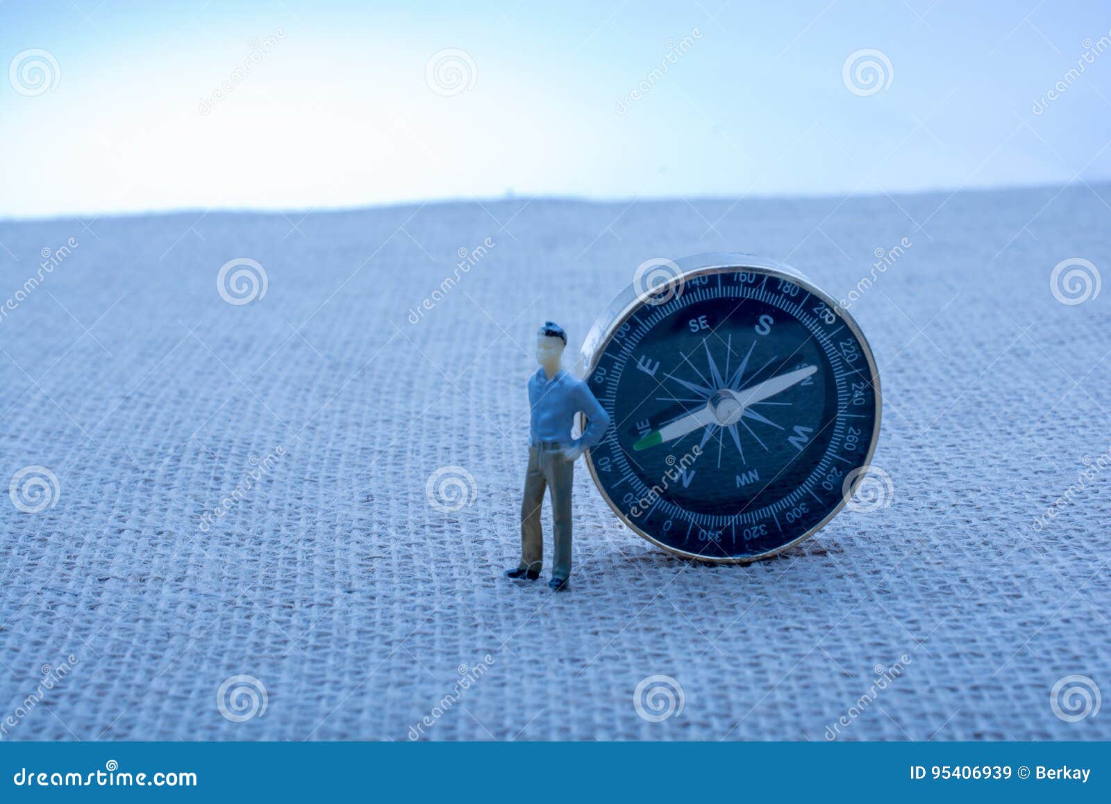 Figurine by the Side of a Compass Stock Image - Image of guidance ...
