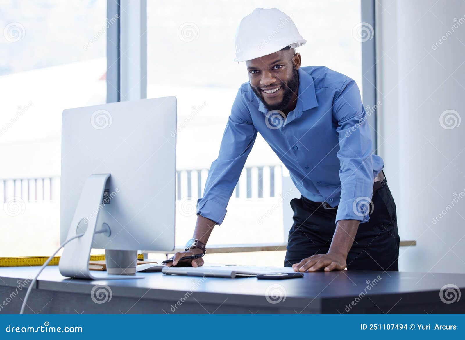 Figuring Out a Plan. Shot of a Young Businessman Using a Computer at ...