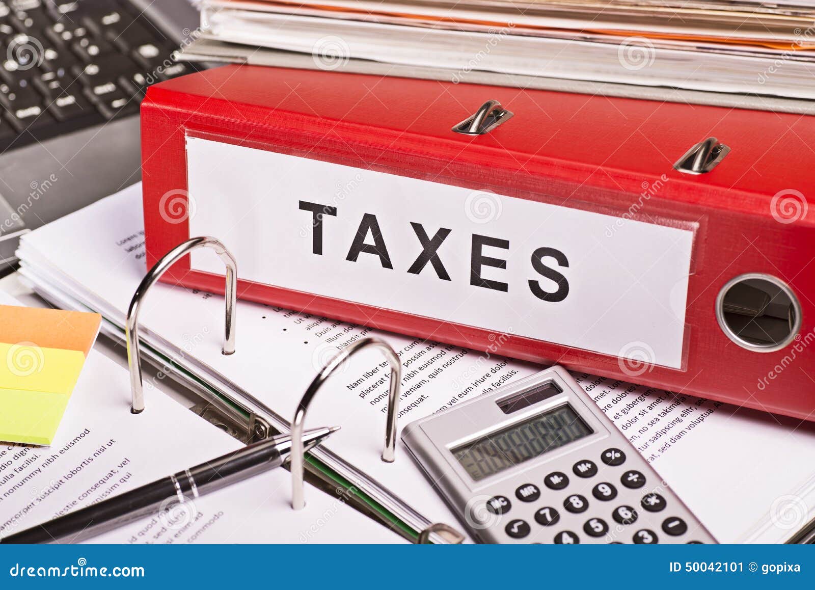 File Folder with the Label Taxes Stock Image - Image of calculator ...