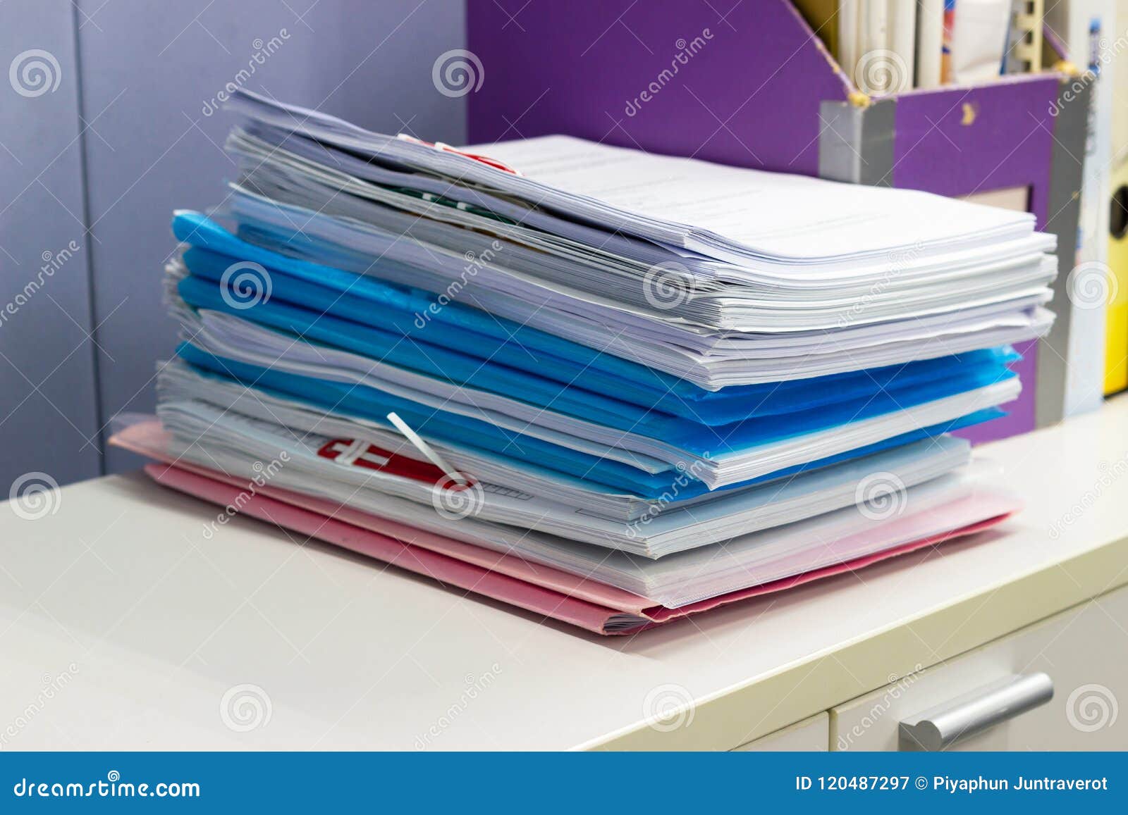 File Folder and Stack of Business Report Paper File on the Table in a ...