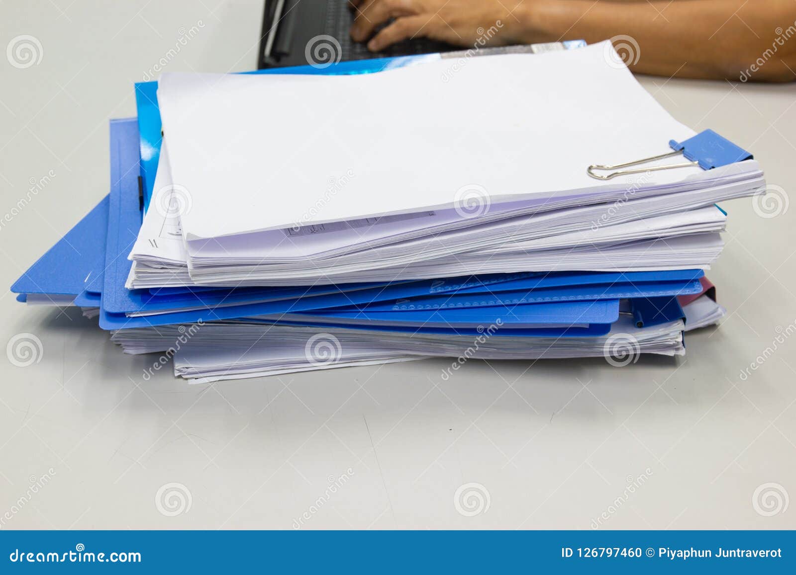 File Folder and Stack of Business Report Paper File on the Table in a ...