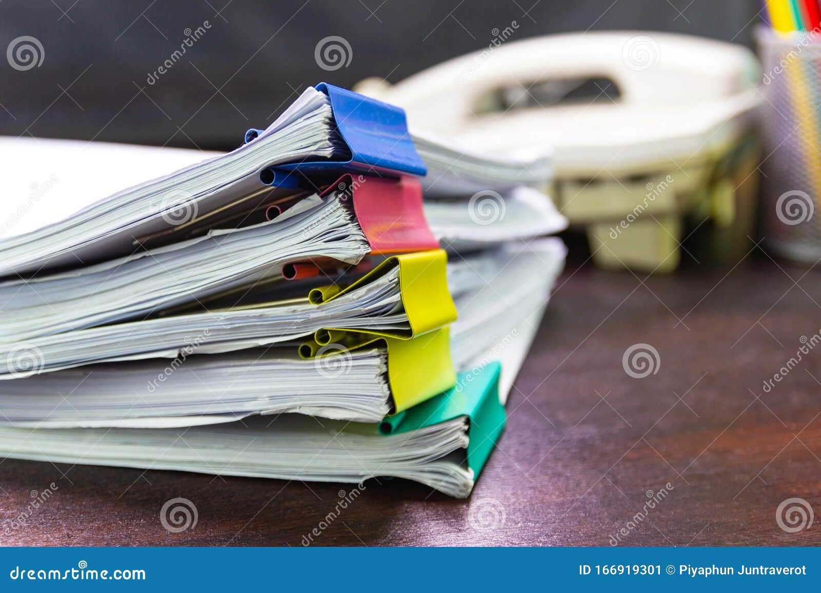 File Folder and Stack of Business Report Paper File on the Table in a ...
