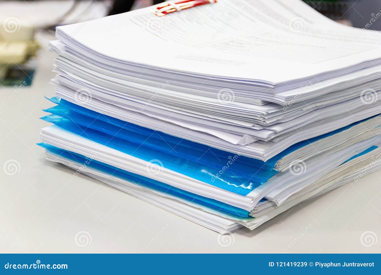 File Folder and Stack of Business Report Paper File on the Table in a ...
