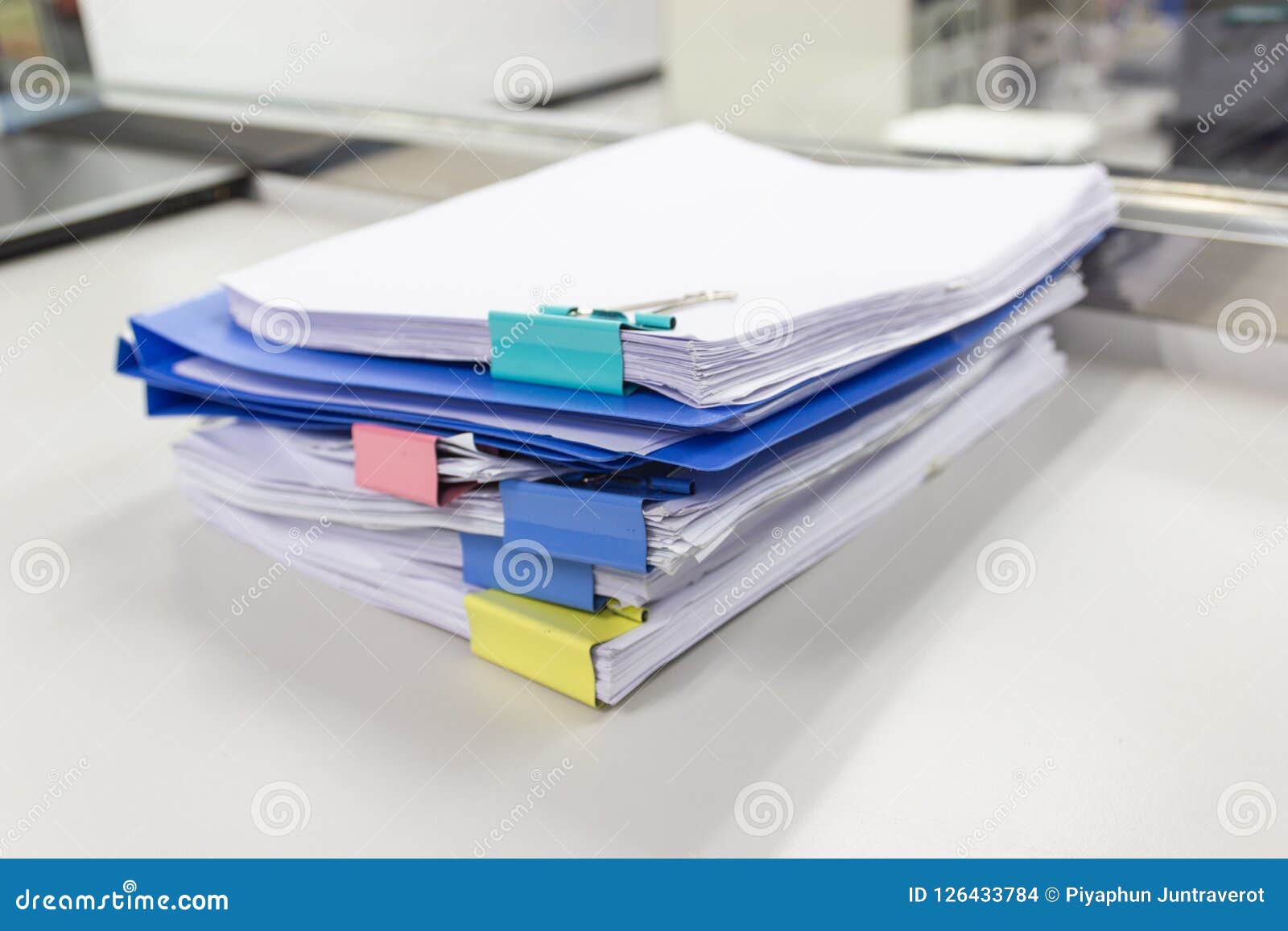 File Folder and Stack of Business Report Paper File on the Table in a ...