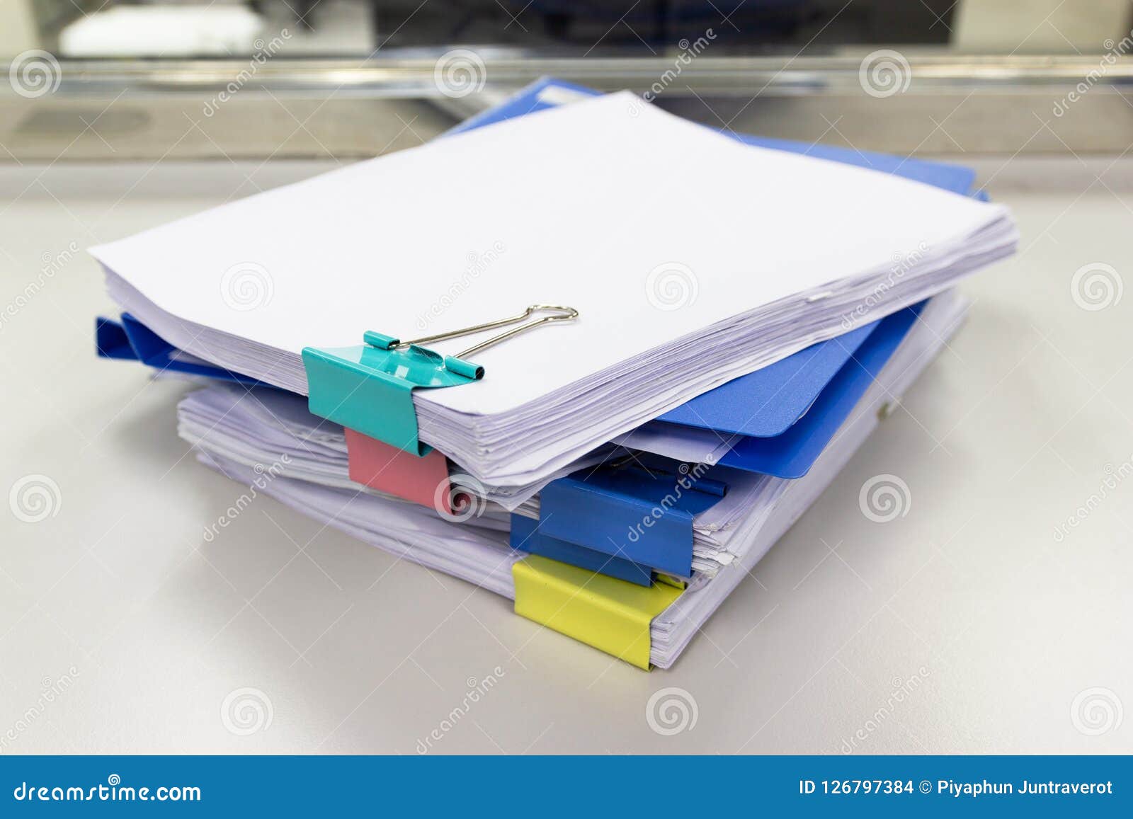 File Folder and Stack of Business Report Paper File on the Table in a ...