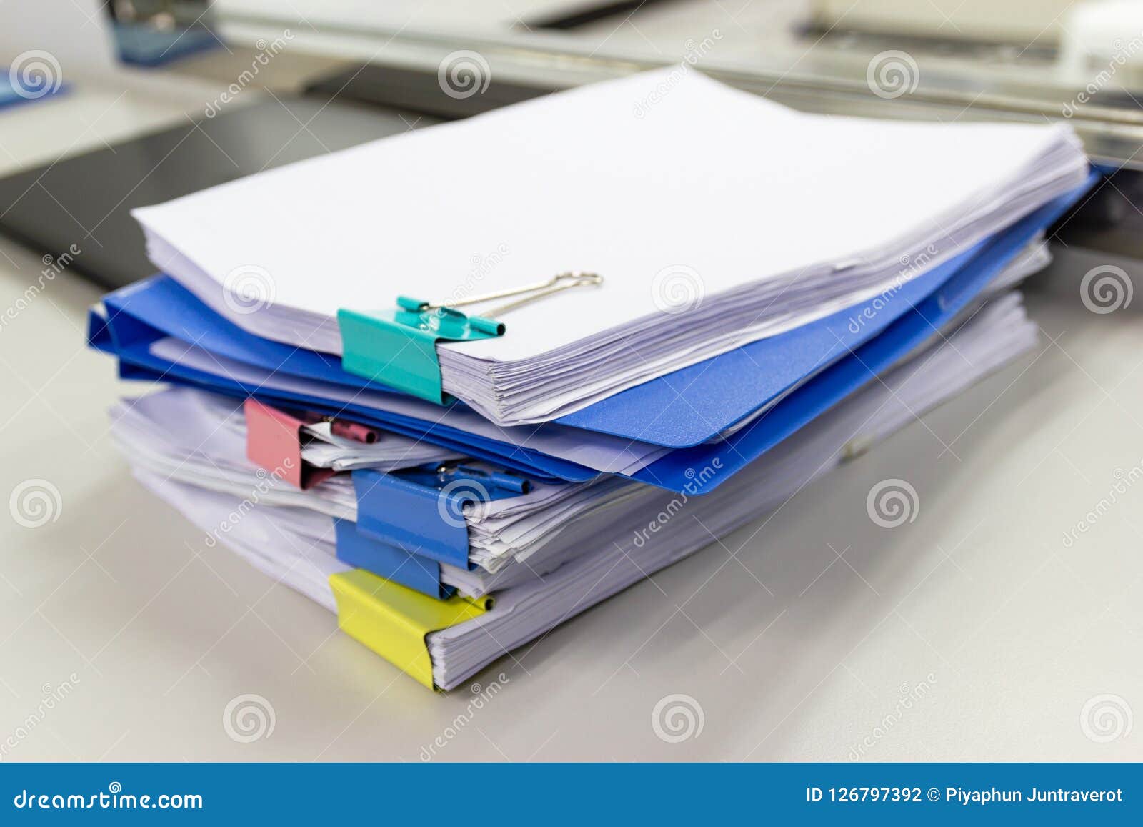 File Folder and Stack of Business Report Paper File on the Table in a ...
