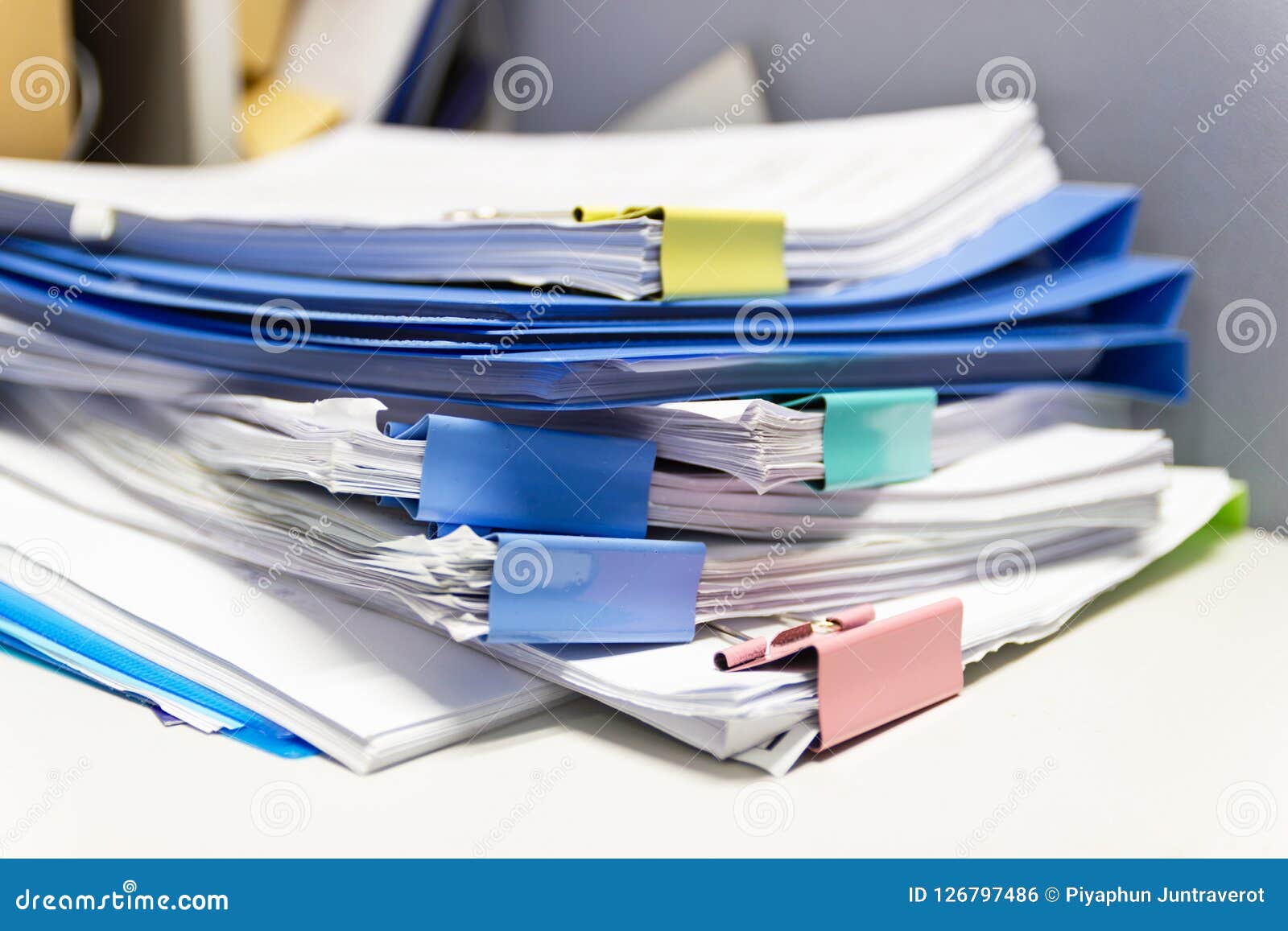 File Folder and Stack of Business Report Paper File on the Table in a ...