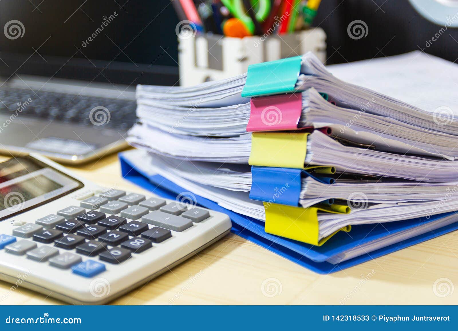 File Folder and Stack of Business Report Paper File on the Table in a ...