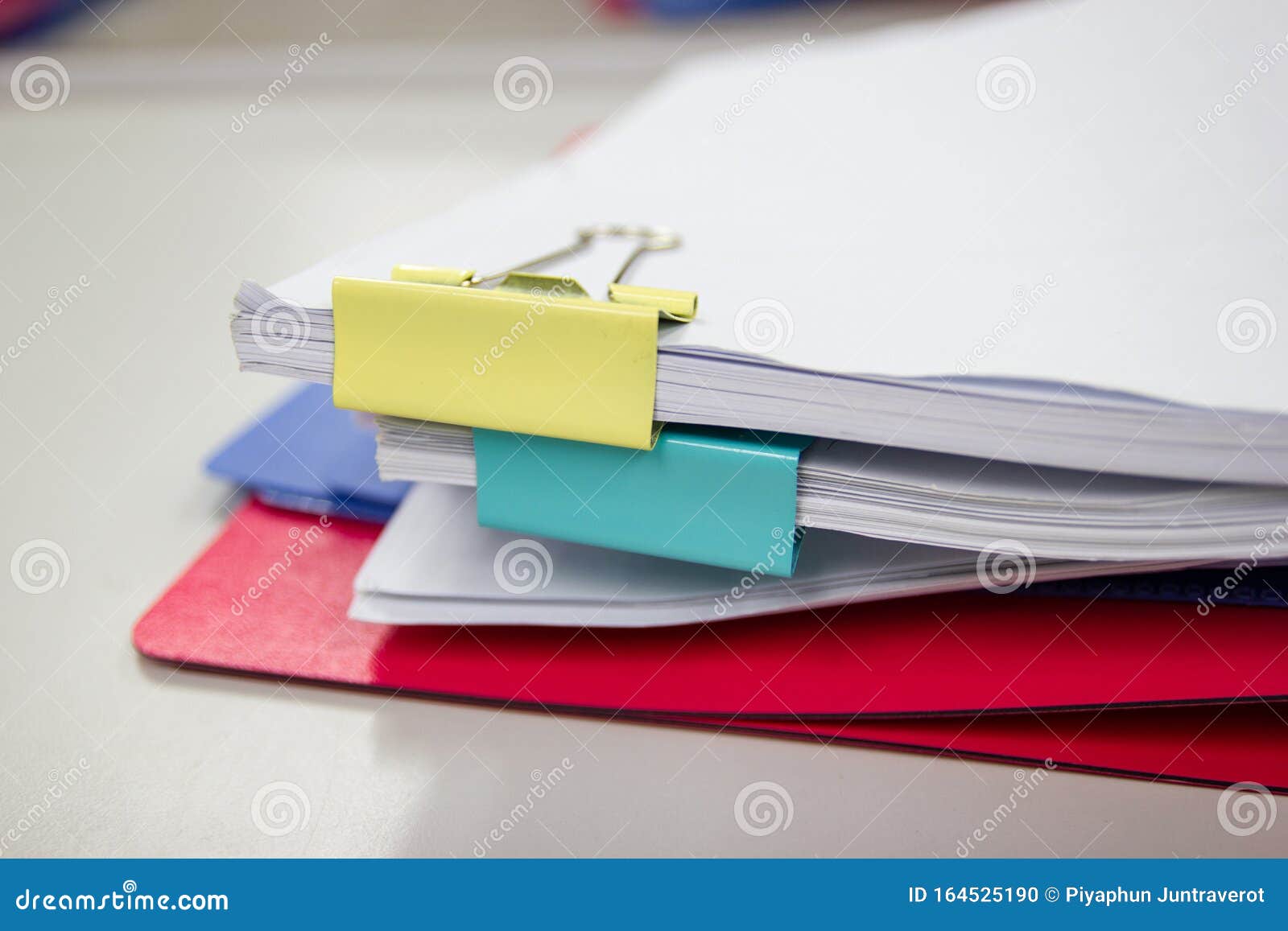 File Folder and Stack of Business Report Paper File on the Table Stock ...