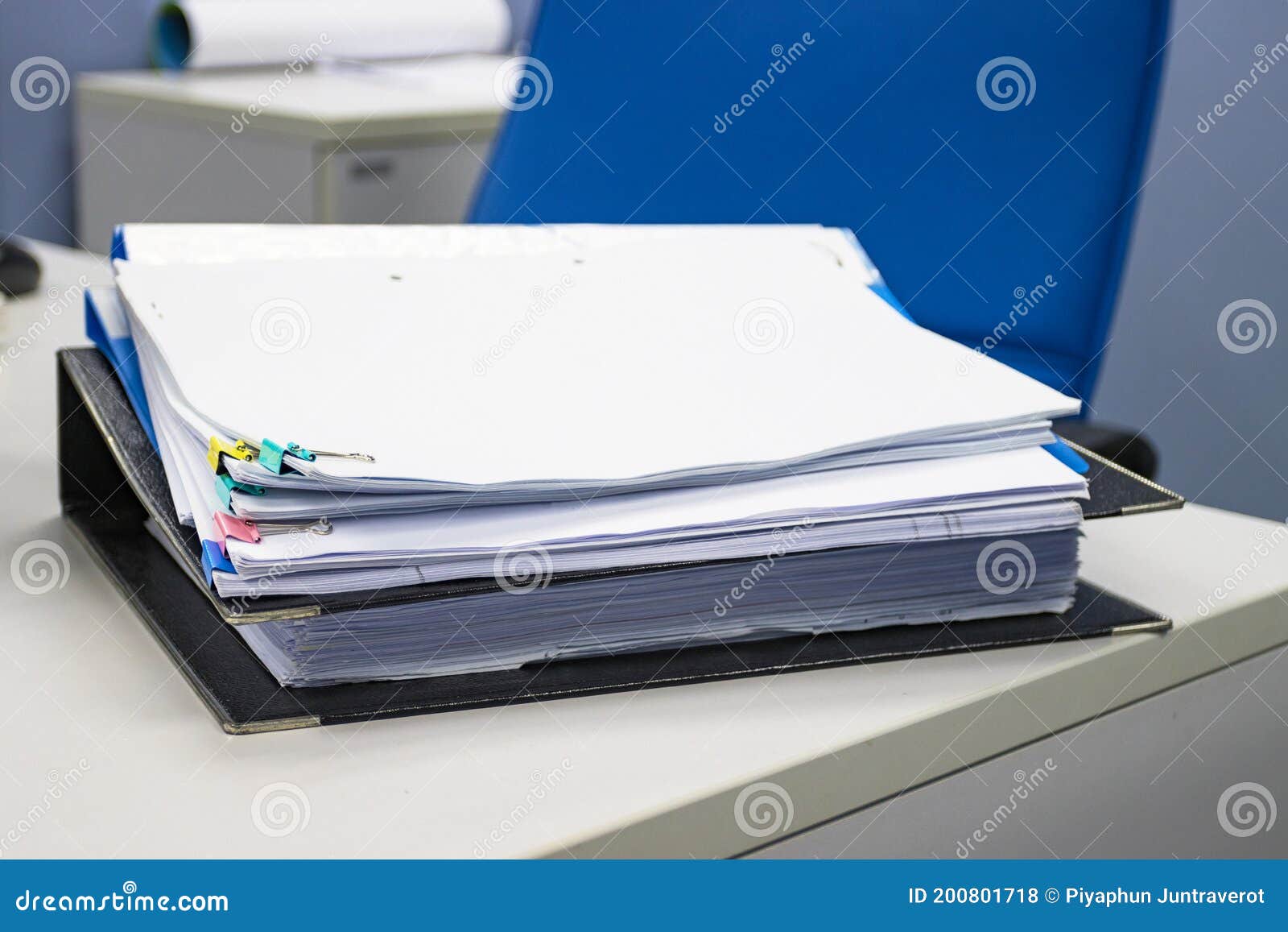 File Folder and Stack of Business Report Paper File on the Table Stock ...