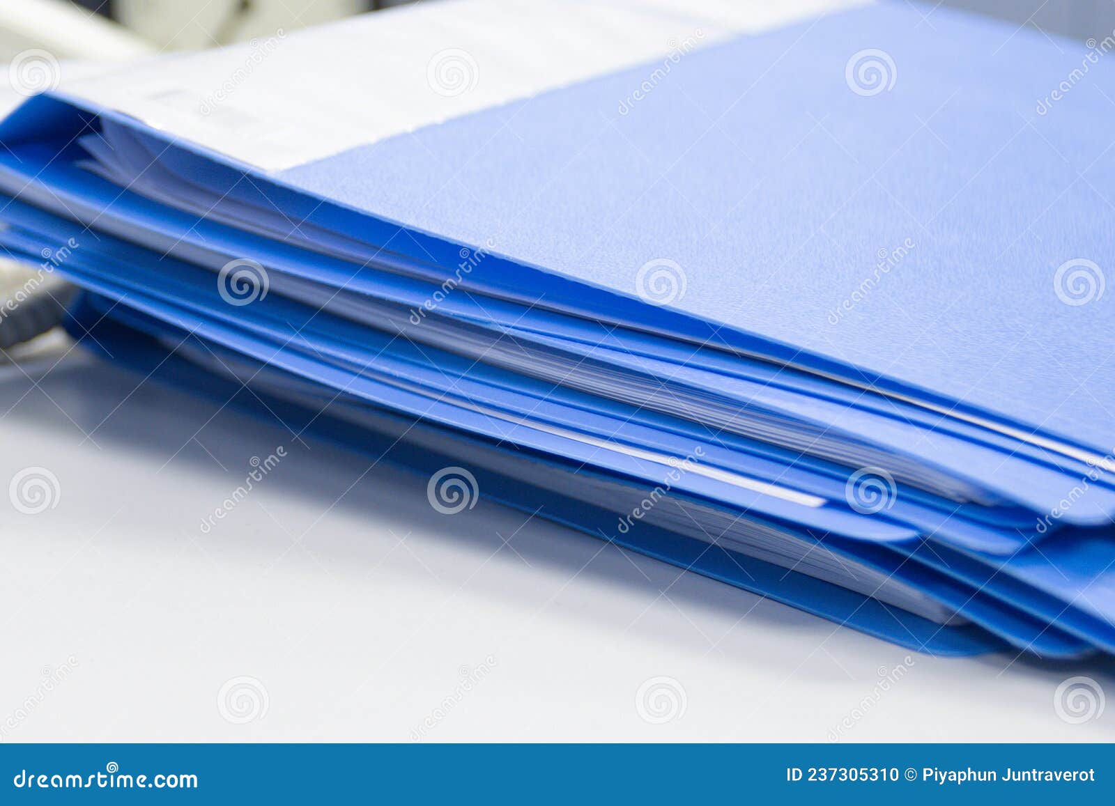 File Folder and Stack of Business Report Paper File on the Table Stock ...
