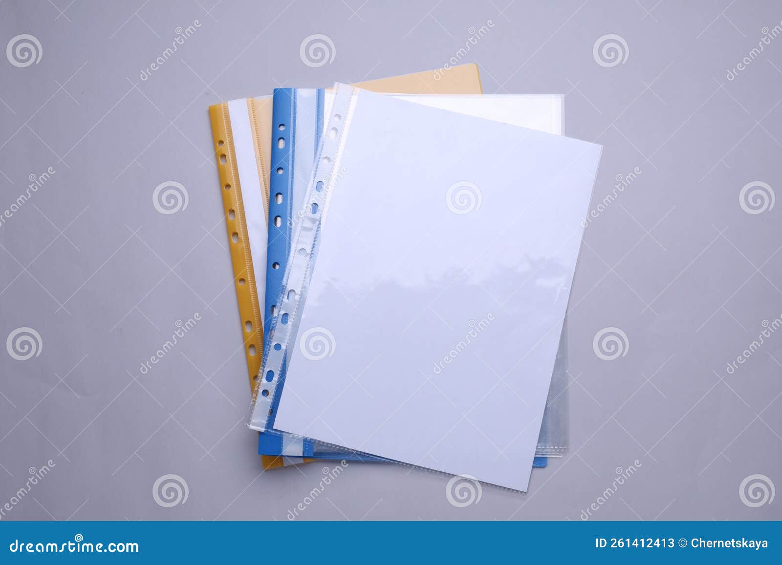 File Folders with Punched Pockets and Paper Sheets on Light Grey ...