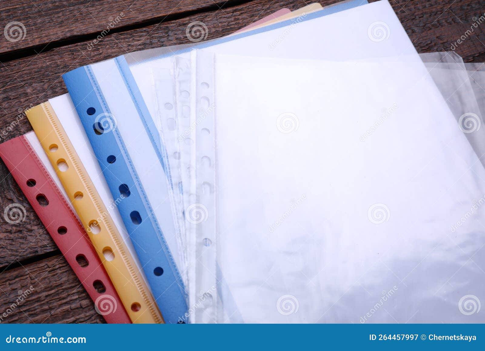 File Folders with Punched Pockets on Wooden Table Stock Image - Image ...