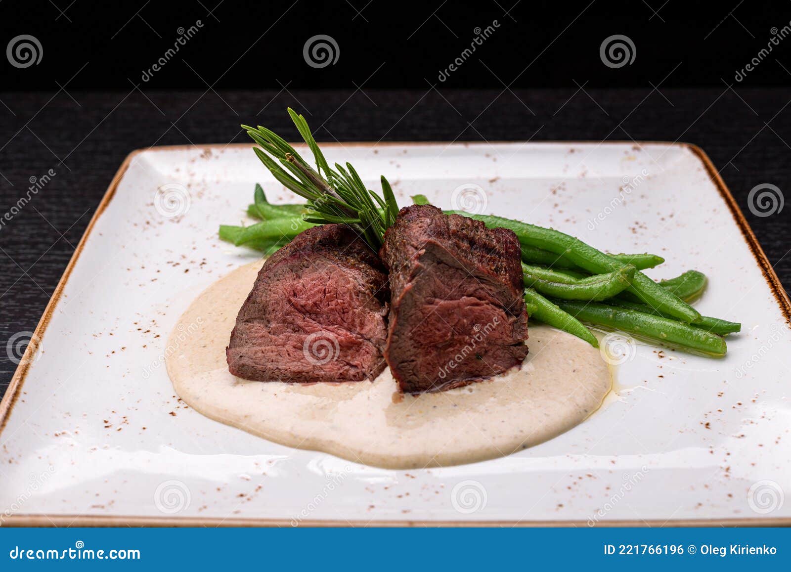 Filet Mignon with Asparagus on a Light Plate, on a Dark Background ...