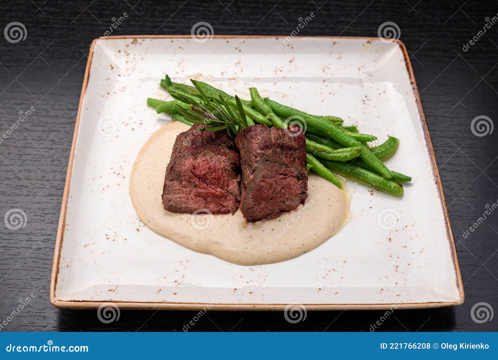 Filet Mignon with Asparagus on a Light Plate, on a Dark Background ...