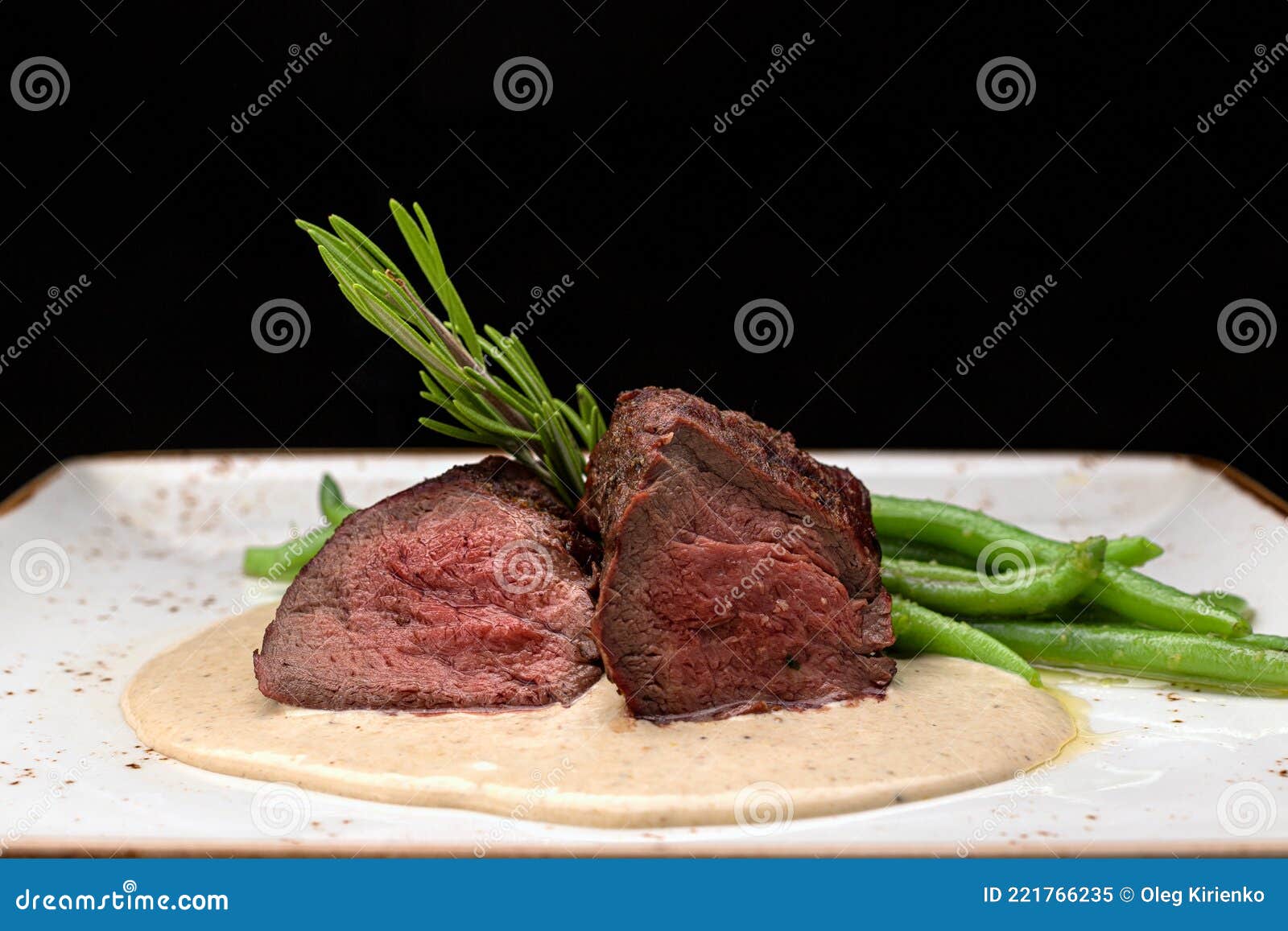 Filet Mignon with Asparagus on a Light Plate, on a Dark Background ...
