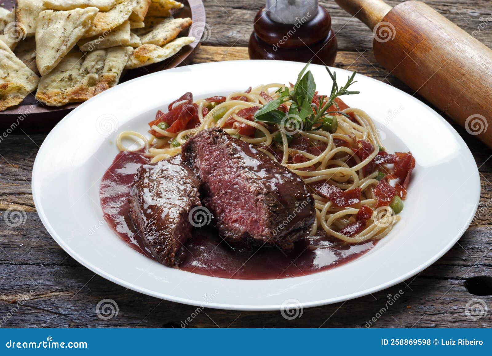 Filet mignon with pasta stock photo. Image of preparation - 258869598
