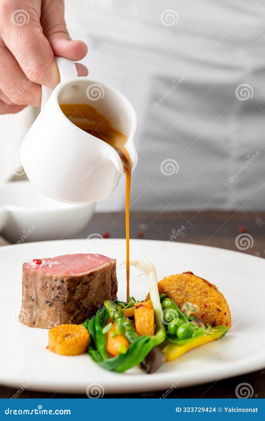 Filet Mignon Served with Vegetables and Sauces at a Fine Dining ...