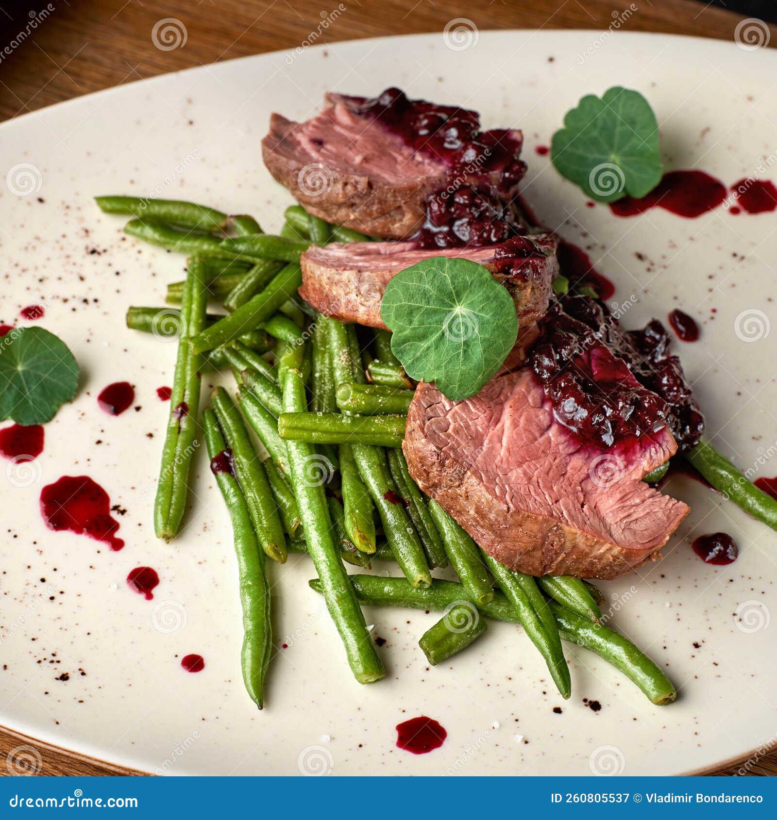 Filet Mignon Steak Dinner with Green String Beans Ion a White Plate ...