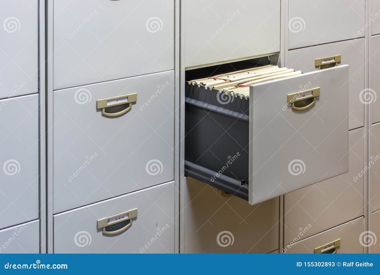 Filing Cabinet with a Slightly Open Drawer Full of Files Stock Image ...