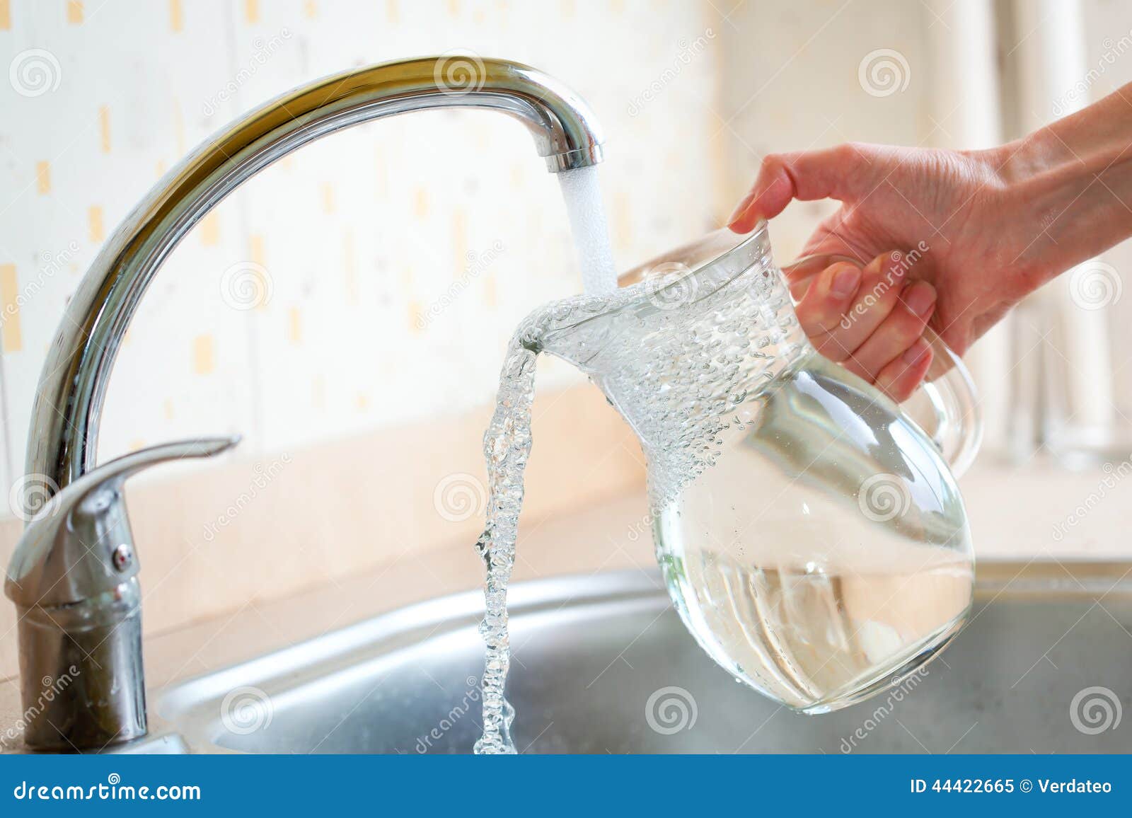 Filing Glass Pitcher with Water Stock Image - Image of glass, faucet ...