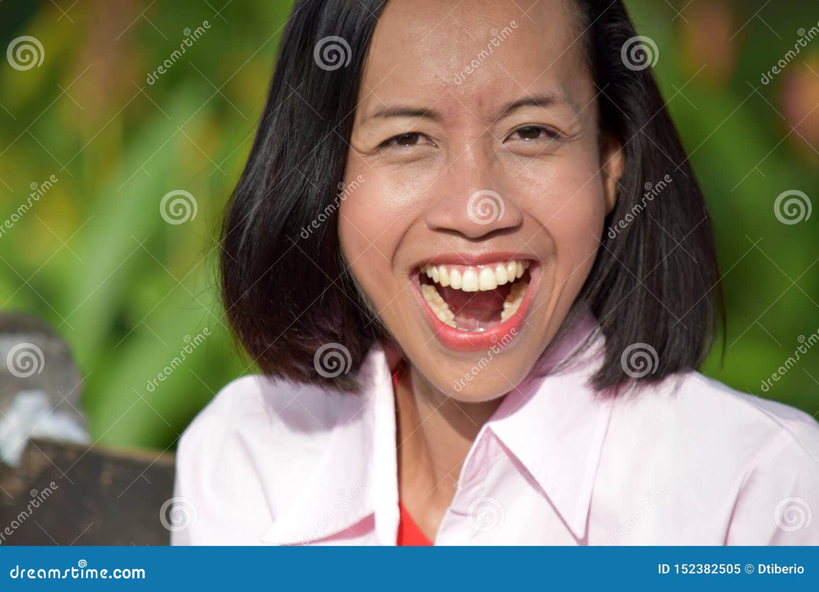 A Filipina Female Laughing stock image. Image of smile - 152382505