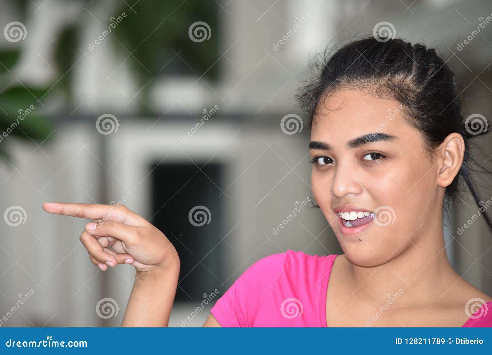 Filipina Female Pointing stock image. Image of direction - 128211789