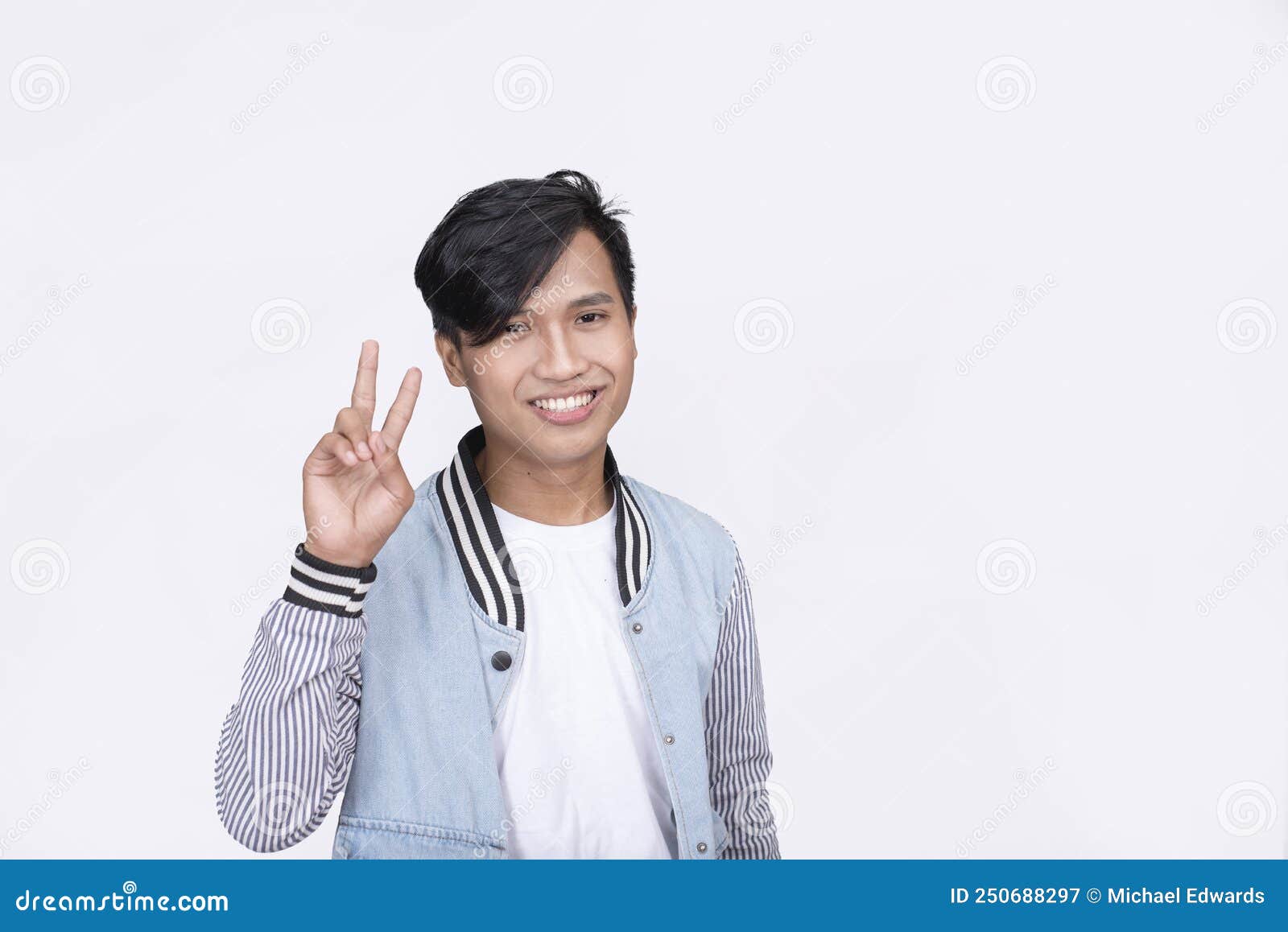 A Filipino Guy Makes a Peace Sign. Isolated on White Background Stock ...
