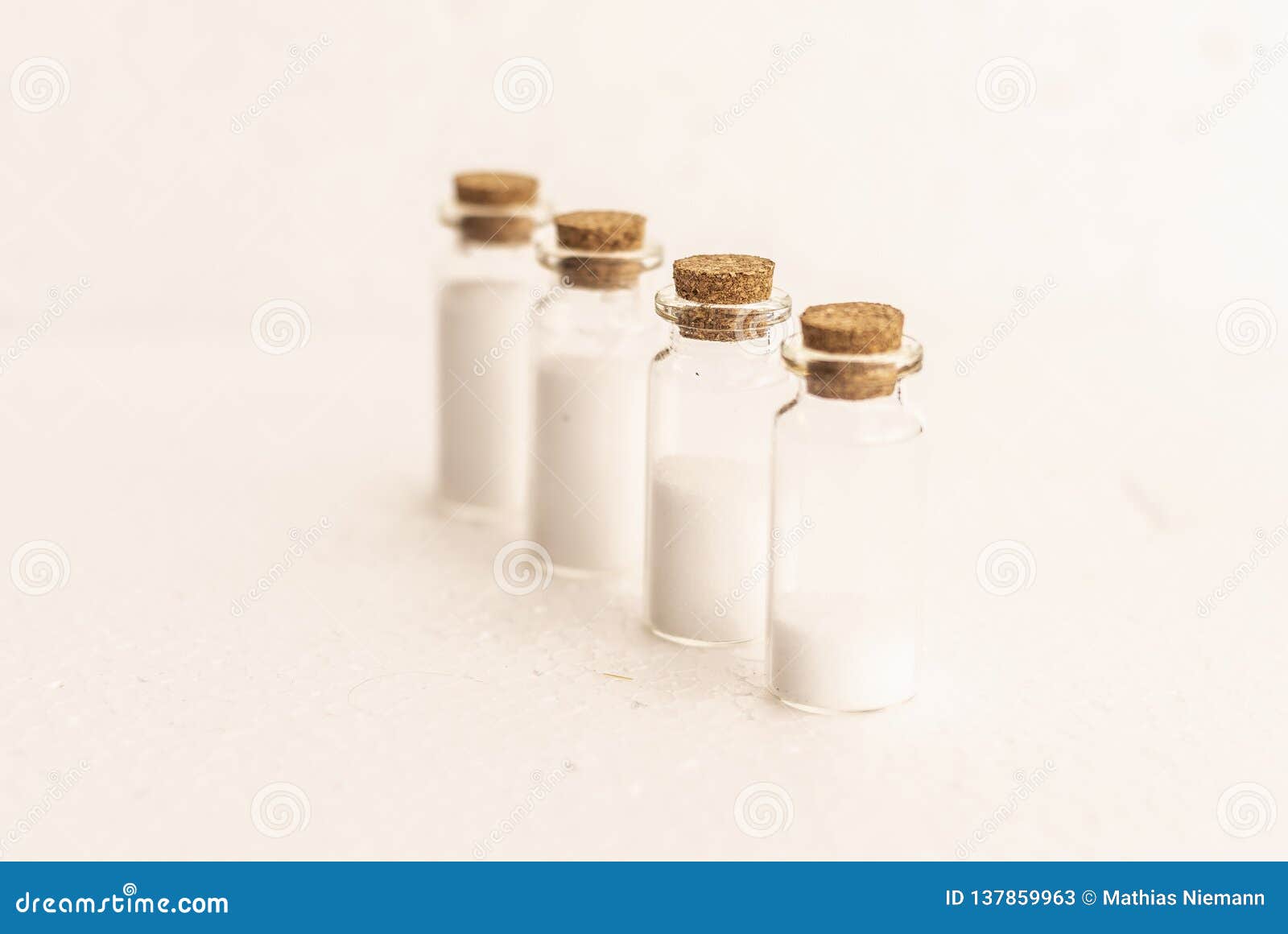 Four Little Bottles Filled with White Powder Stock Image - Image of ...