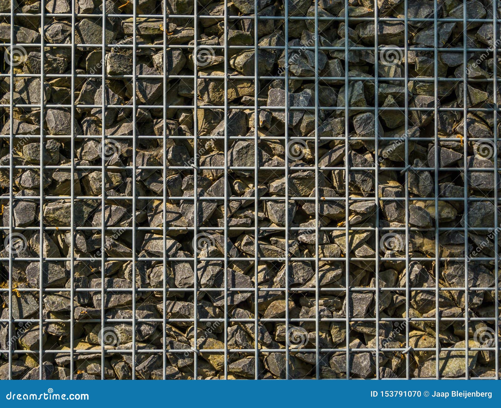 Filled Mesh Basket with Small Rocks, Garden Architecture Background ...