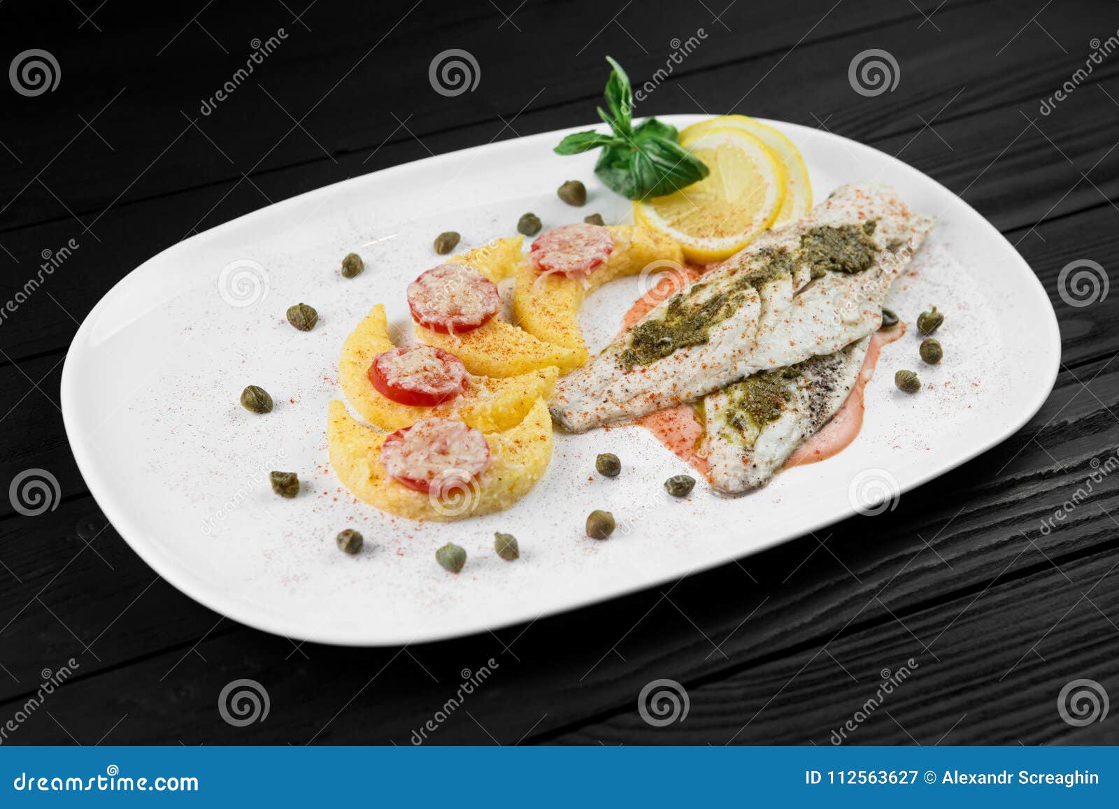 Fillet of Fish Pangasius with Ananas and Capere. Stock Image - Image of ...