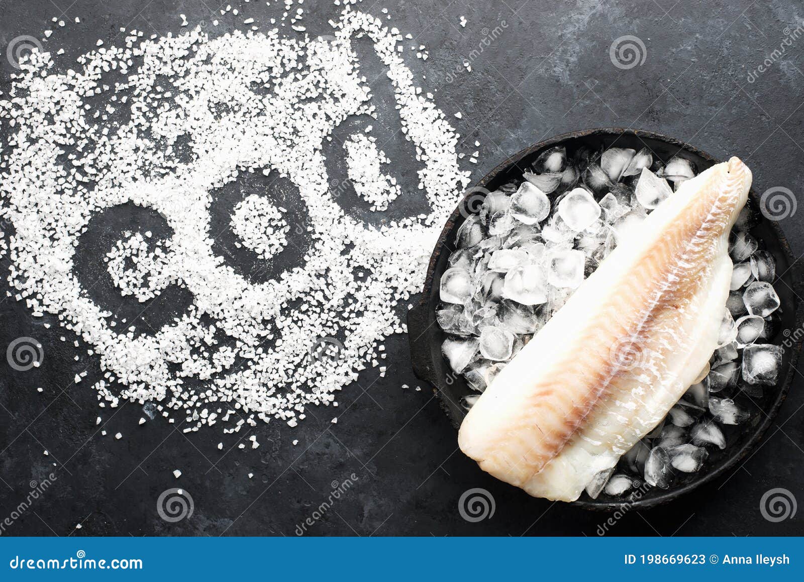 Fillet of White Sea Cold-water Fish Cod in Ice Cubes on a Dark ...