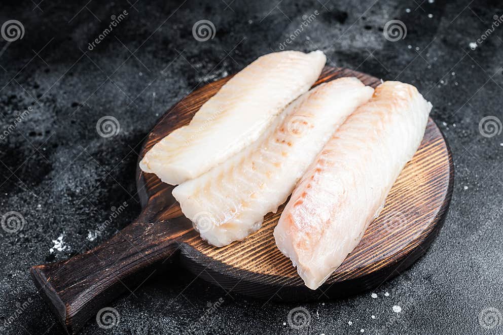 Fillets of Codfish, Raw Cod Fish Meat. Black Background Stock Photo ...