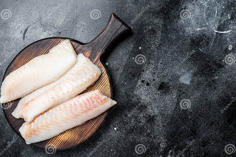 Fillets of Codfish, Raw Cod Fish Meat. Black Background. Top View Stock ...
