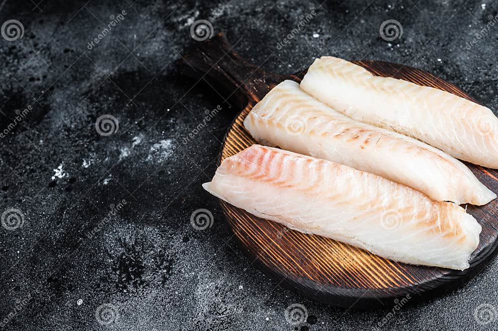 Fillets of Codfish, Raw Cod Fish Meat. Black Background. Top View Stock ...