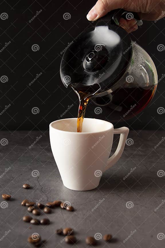 Filling a Coffee Cup with Coffee in Slow Motion Stock Photo - Image of ...