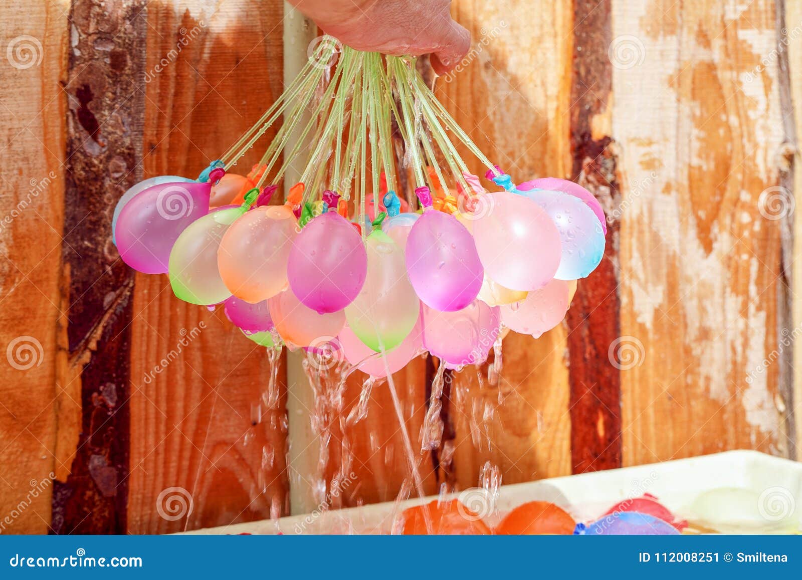 Filling Colorful Water Balloons Stock Image - Image of balloons, full ...