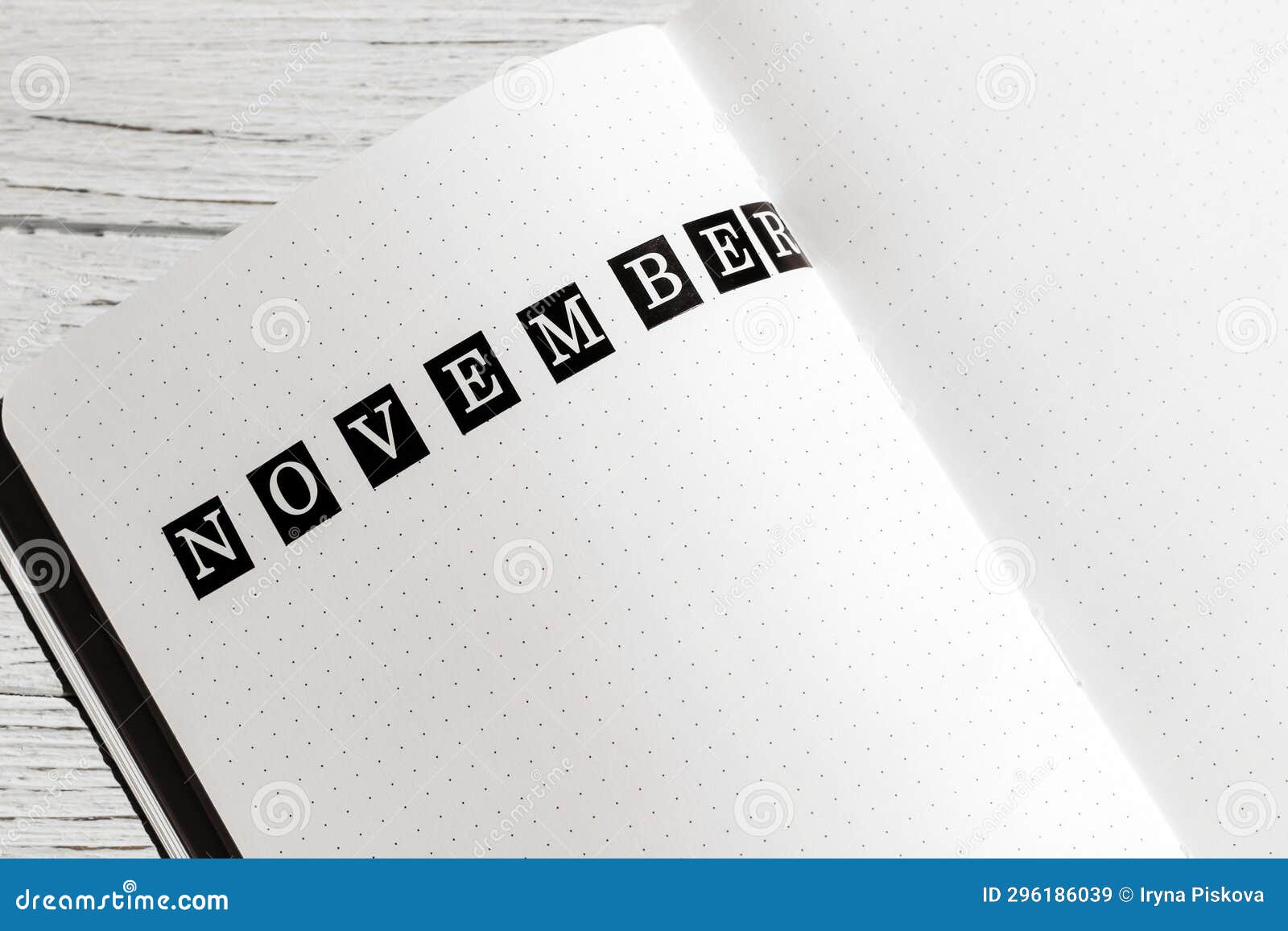 Filling in the Diary, Writing November in a Notebook in a Dot Stock ...