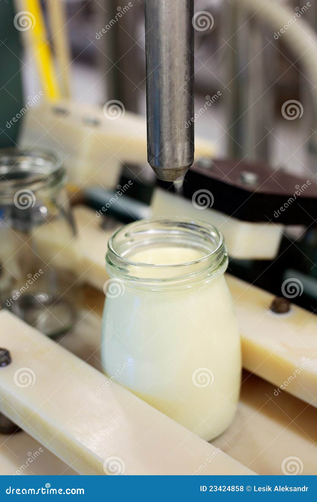 Filling Glass Containers of Dairy Products Stock Photo - Image of milk ...