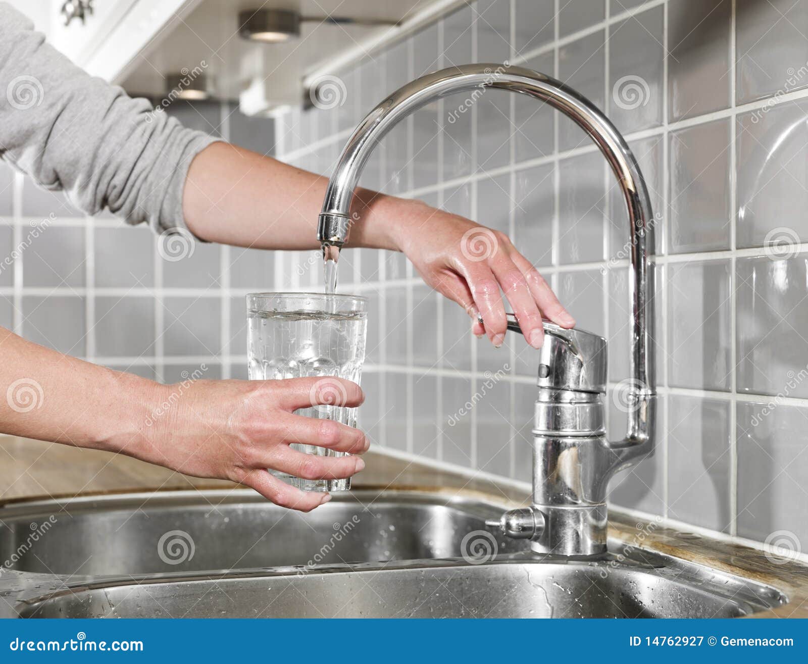 Filling a glass of water stock image. Image of drink - 14762927