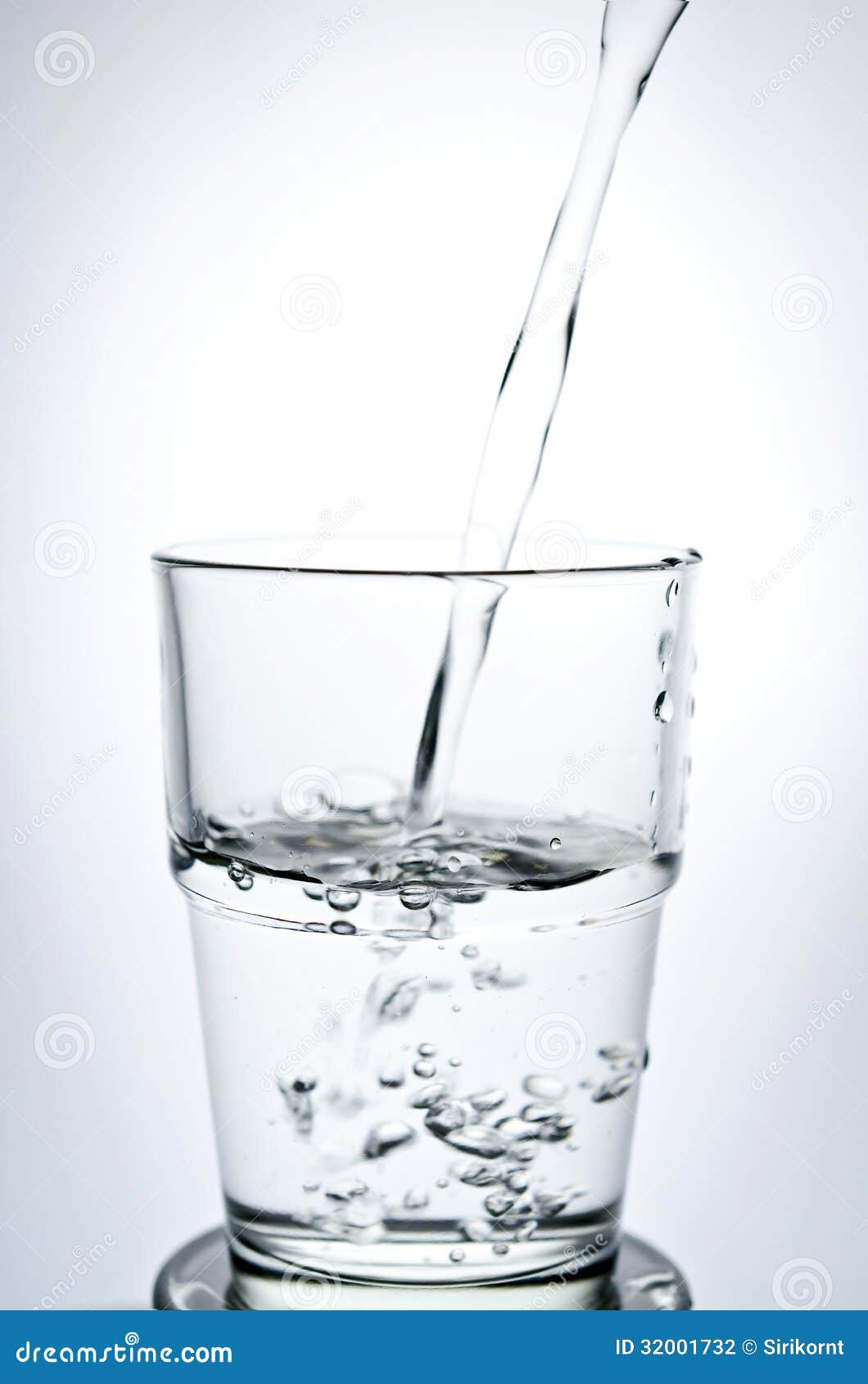 Filling a Glass with Water Showing a Drink Concept Stock Photo - Image ...