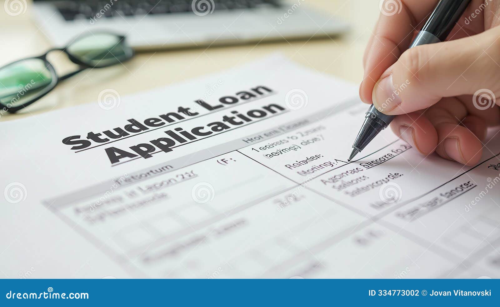 Filling Out a Student Loan Application Form with a Pen Stock ...